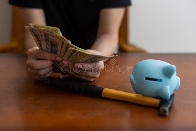 Man Breaking Piggy Bank with Hammer on Table Stock Photo - Image of ...
