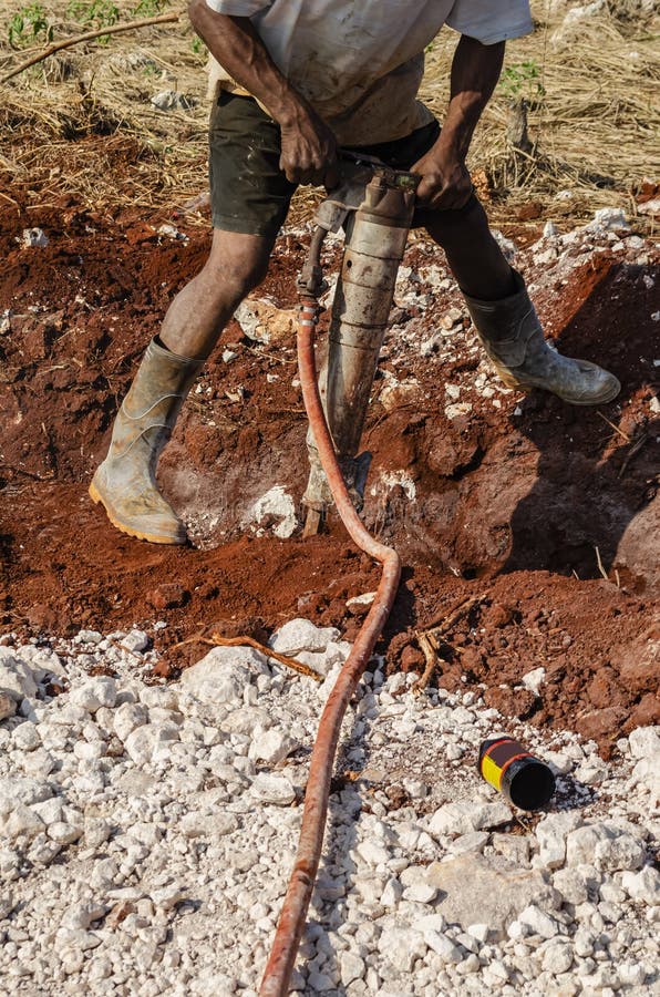 Man Breaking Rocks with Jackhammer Stock Image - Image of machinery ...