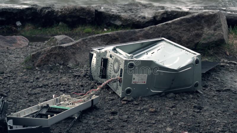 Man Breaks a Hammer System Unit Computer. Man with a Sledge Hammer and ...