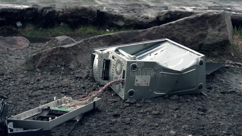 Man Breaks a Hammer System Unit Computer. Man with a Sledge Hammer and ...