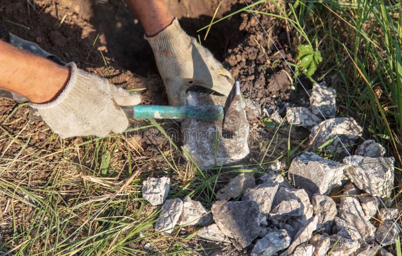 A Man Breaks Stones with a Hammer Stock Photo - Image of break, work ...