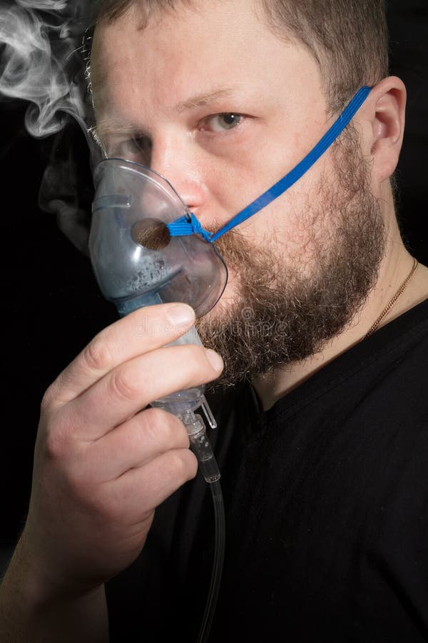 Man Breathing through Nebulizer Mask Stock Photo - Image of breathing ...