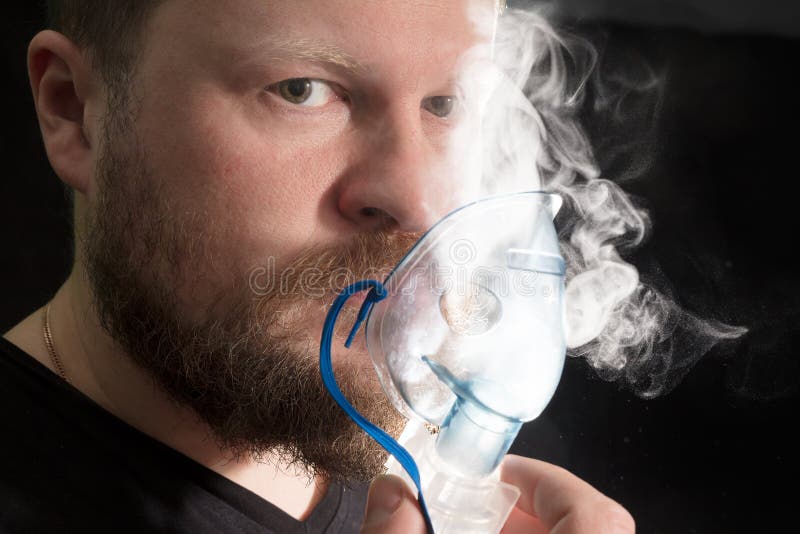 Man Breathing through Nebulizer Mask Stock Photo - Image of asthma ...
