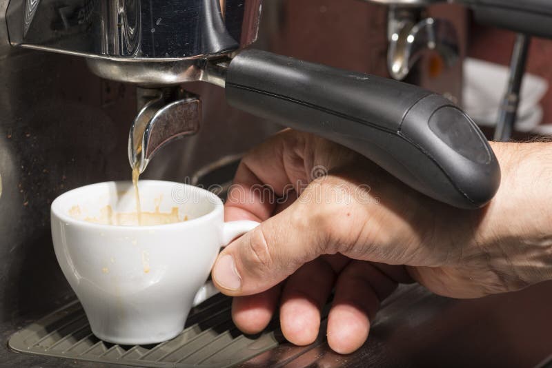 A Man Brews Coffee at an Automatic Coffee Machine Stock Photo - Image ...