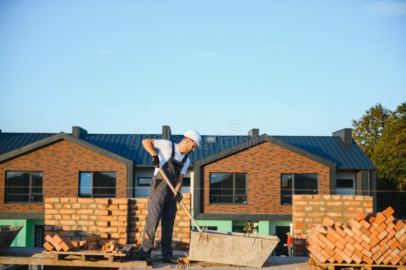 Man Bricklayer Installing Bricks on Construction Site Stock Image ...