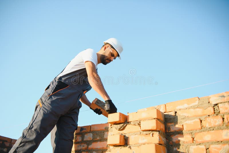 Man Bricklayer Installing Bricks on Construction Site Stock Image ...