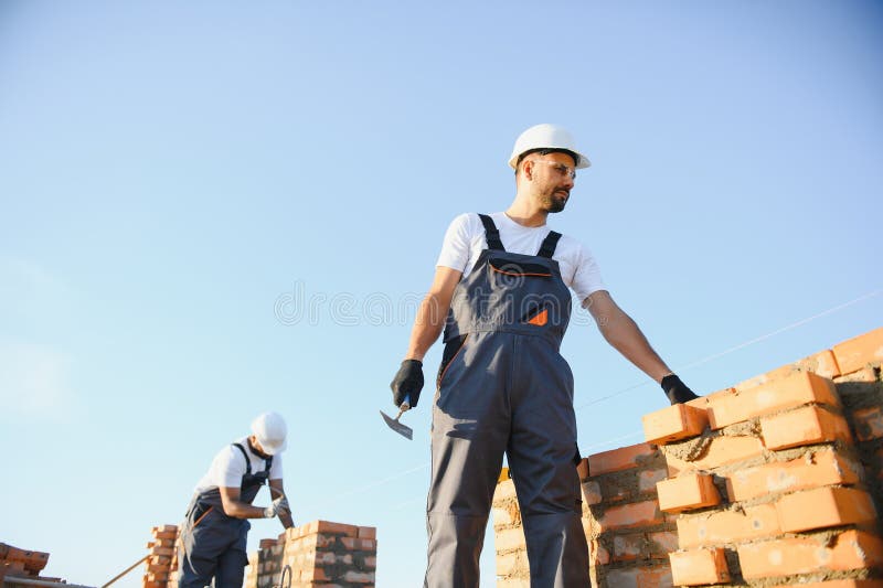 Man Bricklayer Installing Bricks on Construction Site Stock Image ...