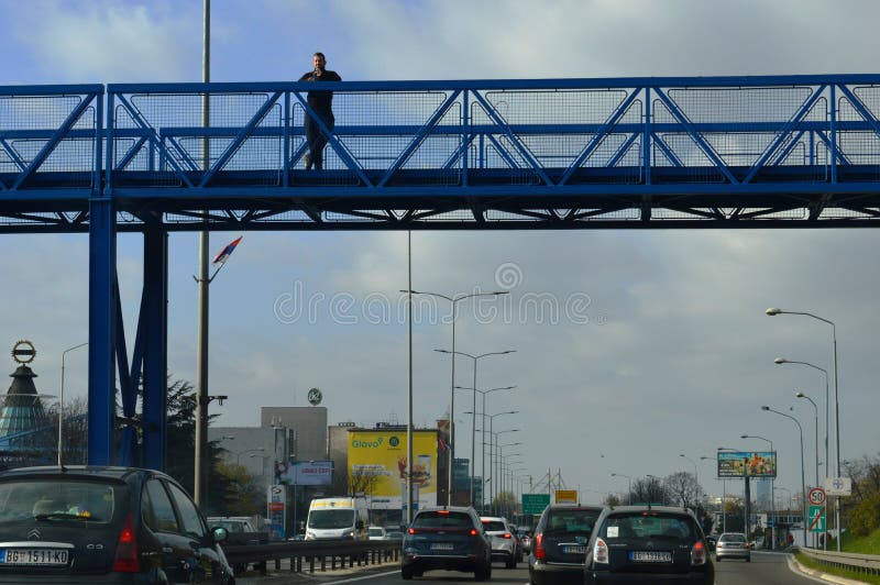 Man on the Bridge is Filming Vehicles Editorial Photo - Image of people ...