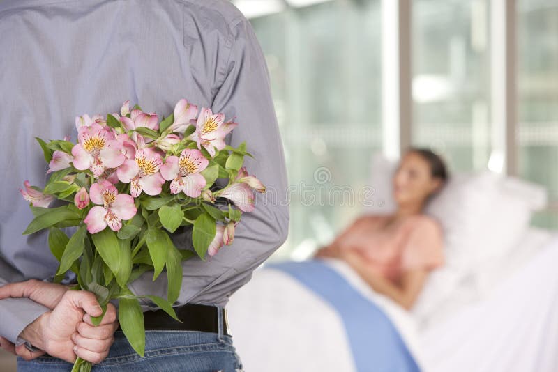 Man Bringing Flowers To Patient Stock Image - Image of mother, cheerful ...