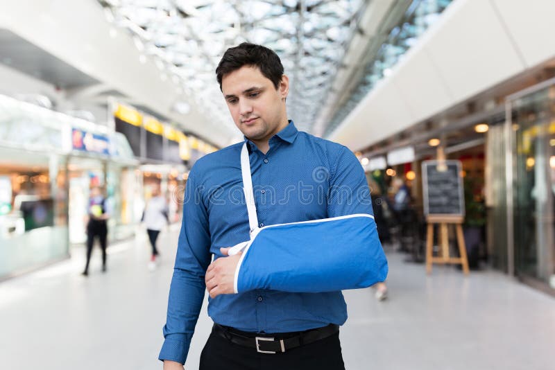 Man with Broken Arm in Airport Stock Photo - Image of accident, airport ...