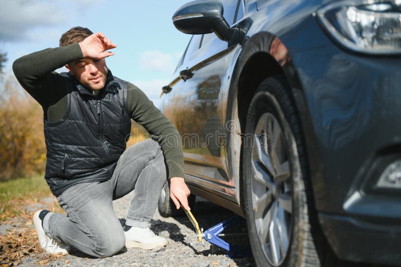Man with Broken Down Car Flat Tire in the Middle of the Street Stock Image - Image of fail ...