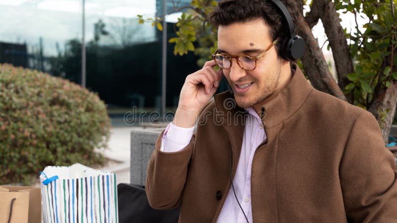 Man with Brown Coat Speaking into Headset Microphone Stock Image ...