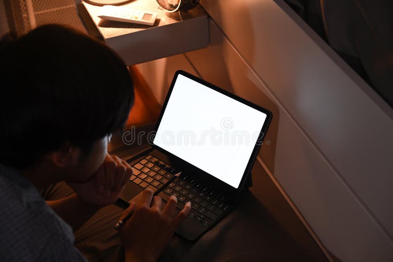 Man Browsing Internet with Computer Table at Night in the Bedroom ...