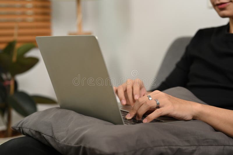 Man Browsing Internet with Laptop on Sofa. Stock Image - Image of ... Man Browsing Internet with Laptop on Sofa. Stock Image - Image of ...