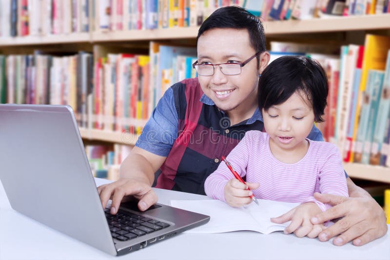 Man Browsing Internet while Teaching a Student Stock Photo - Image of ...