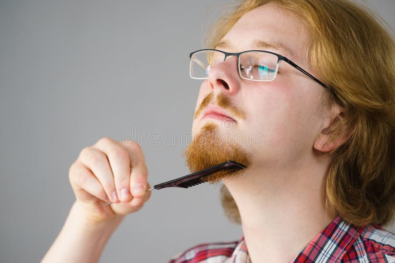 Man Brushing His Beard Using Comb Stock Photo - Image of beard, facial ...