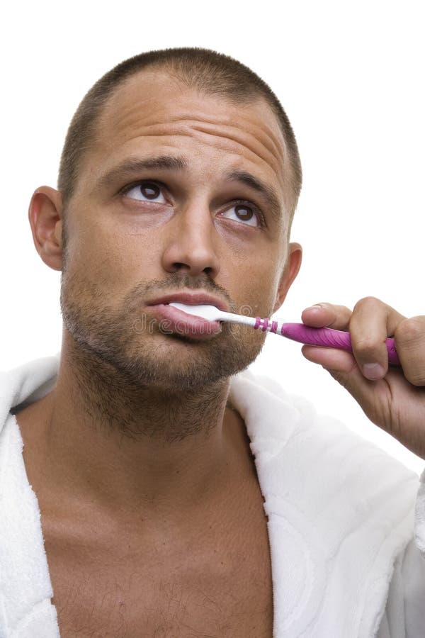 Man Brushing his Teeth stock photo. Image of background - 11329718