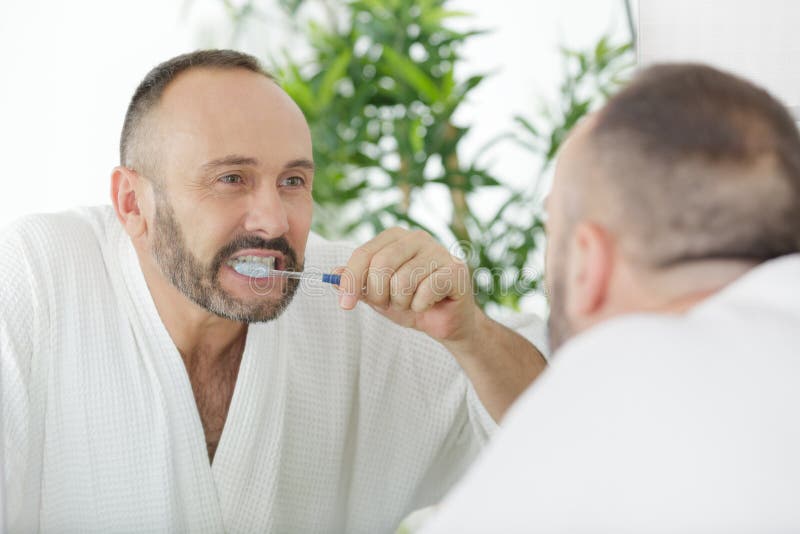Man brushing teeth stock photo. Image of lifestyle, asian - 160146000