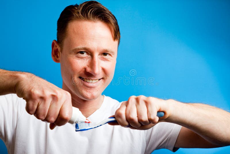 Man Brushing His Teeth stock image. Image of toothbrush - 88165179