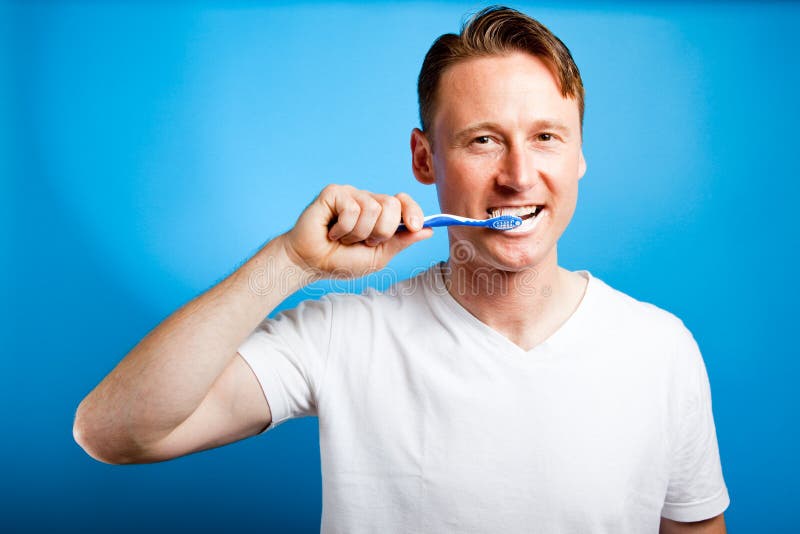 Man Brushing His Teeth stock image. Image of white, toothbrush - 91061241
