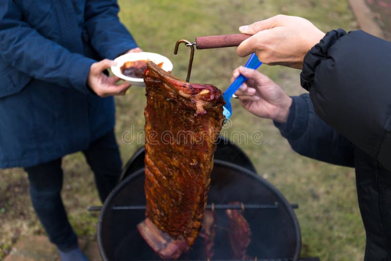 Man Brushing Sauce on Barbecue Spare Ribs Stock Photo - Image of baked ...