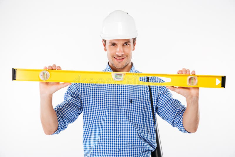 Man Builder in Building Helmet Holding Spirit Level Stock Image - Image ...