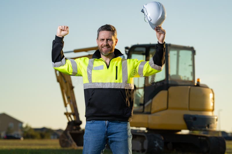 Man Builder Near Excavator. Builder Worker with Excavator. Builder in ...