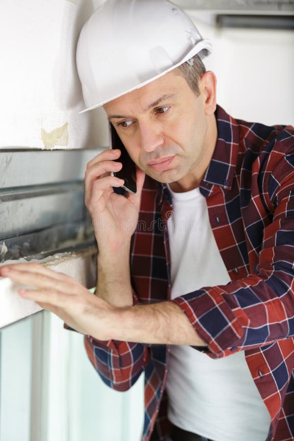 Man builder on phone stock image. Image of work, architecture - 243559875