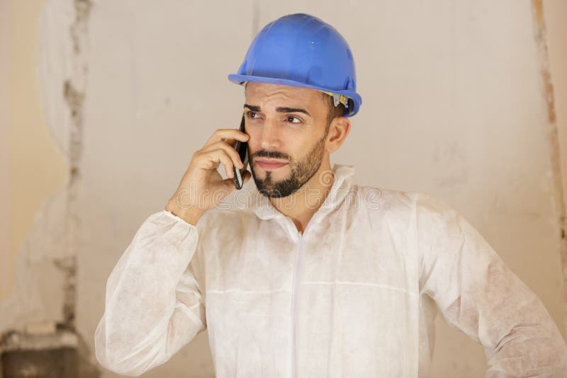 Man builder on phone stock image. Image of happy, attractive - 213618511