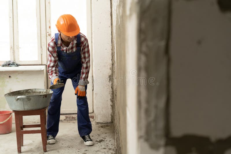Man Builder Plasterer Using Trowel To Plastering Cement Wall in Home ...