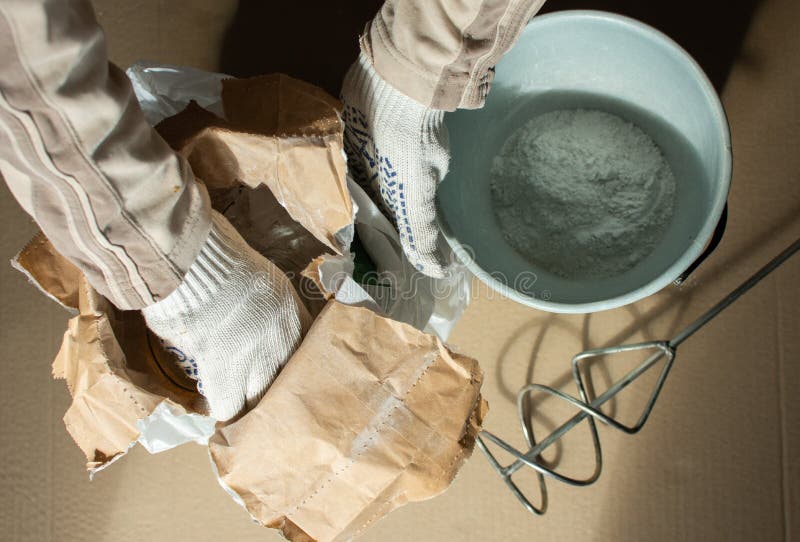 Man Builder Prepares a Mixture for Putty Stock Photo - Image of drill ...