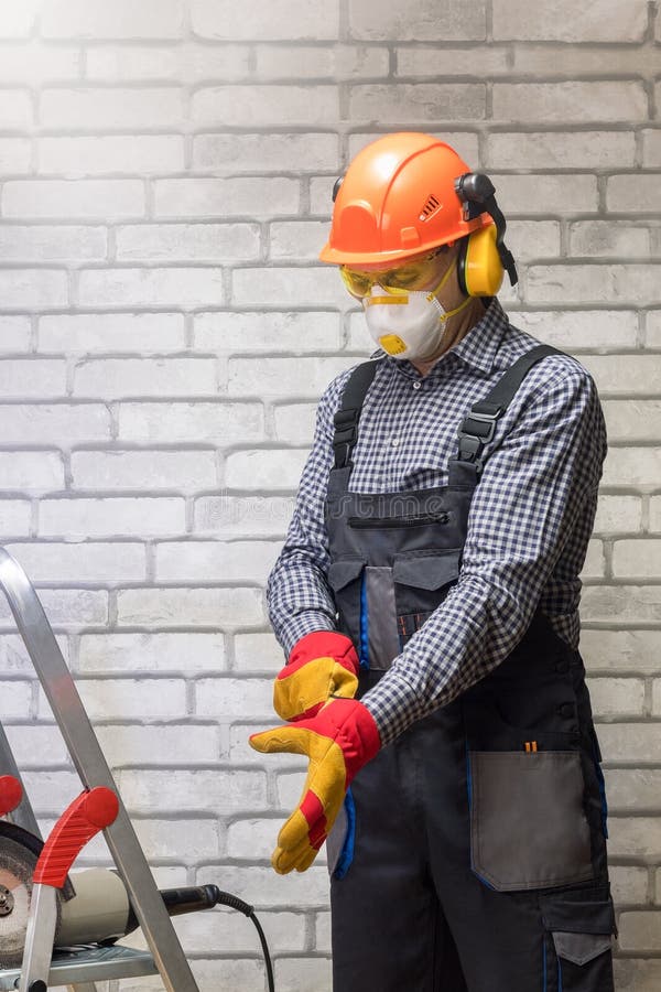Builder Putting on Personal Protective Equipment. Stock Image - Image ...