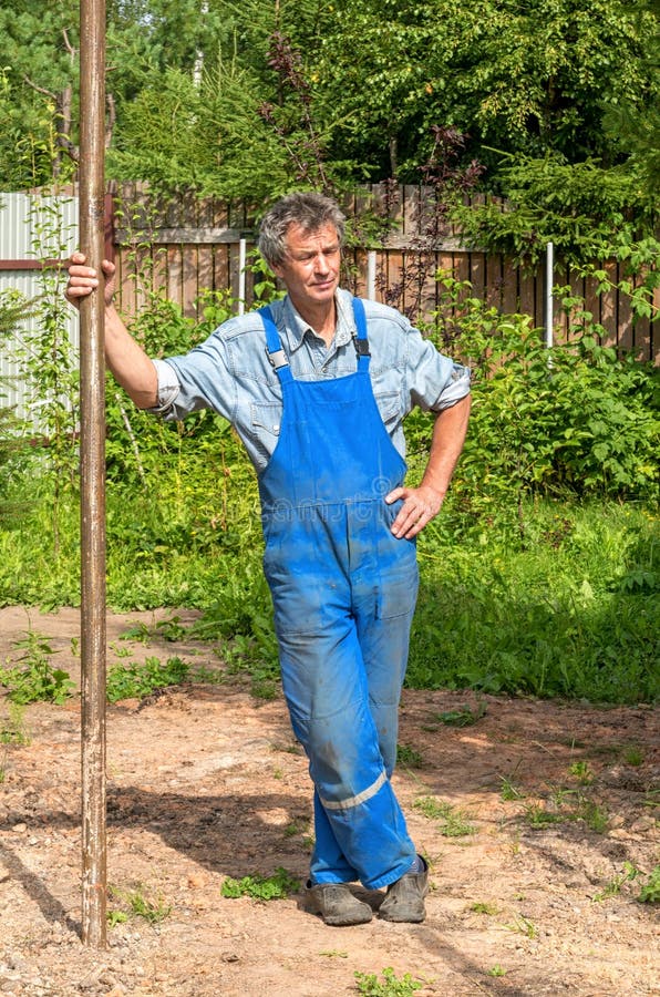 Man is a Builder on a Real Construction Site in Nature. Construction of ...