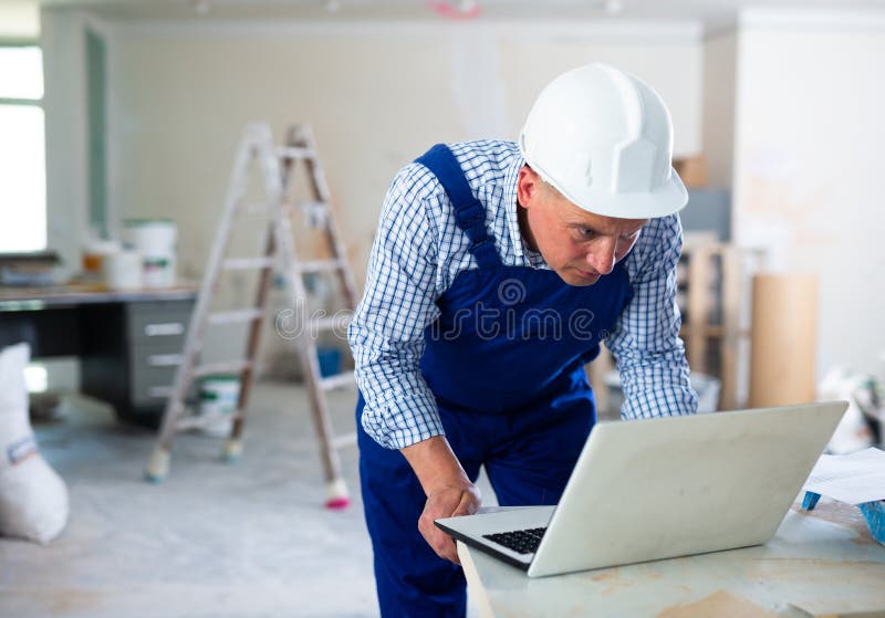Man Builder Using Laptop in Construction Site Stock Image - Image of ...