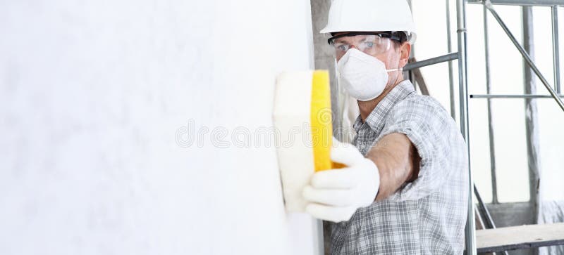 Man Builder Using a Sponge on Wall Professional Construction Worker ...