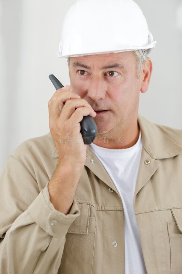Man Builder Using Walkie Talkie Stock Image - Image of looking, smile ...