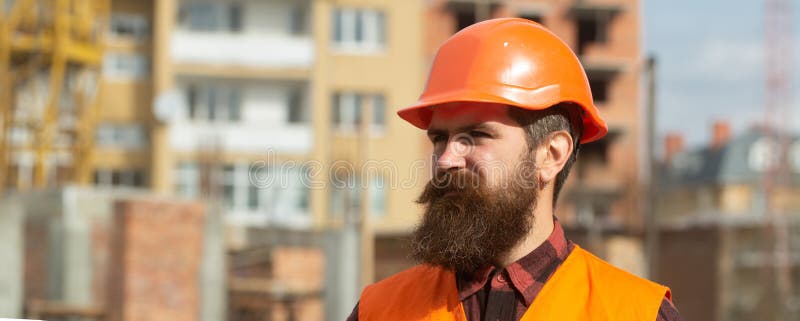 Man Builder Worker in Helmet Posing on Construction Site. Building and ...