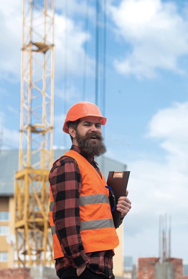 Man Builder Worker in Helmet Posing on Construction Site. Industrial ...