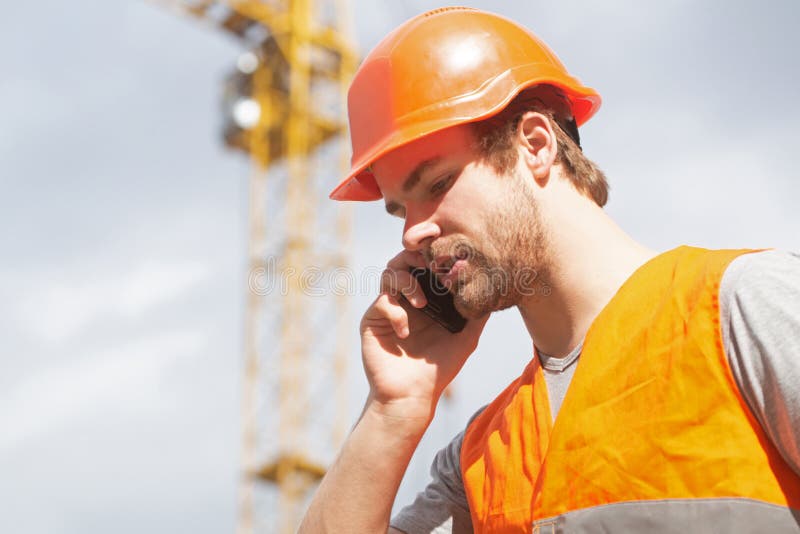 Man Builder Worker in Helmet Posing on Construction Site. Portrait of ...