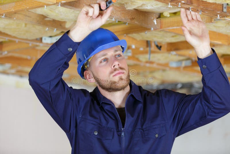 Man Builder Working on Ceiling Stock Image - Image of installing ...