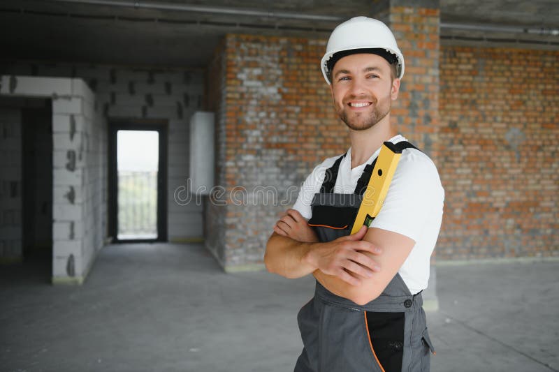 Man Builder Working in Construction Site. Male Repairer in Overall and ...
