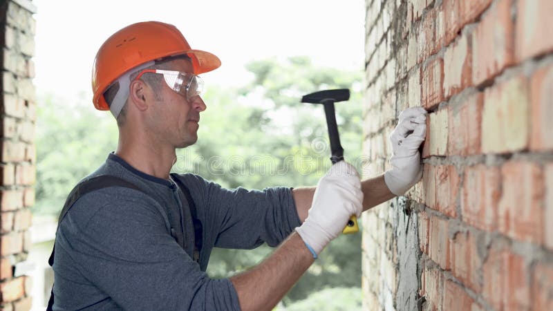 Hammering a Wall Anchor into Drywall for Secure Mounting in a Home ...