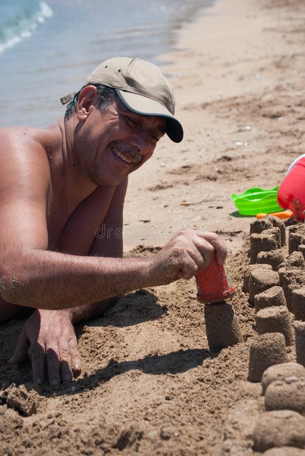 Man Building Castles on the Sand Stock Image - Image of happy, build ...