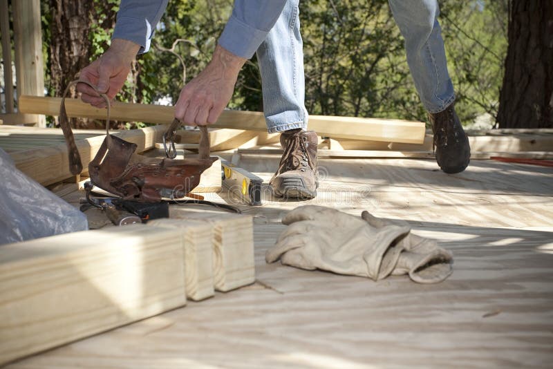 Man Building a Deck stock photo. Image of construction - 19830860