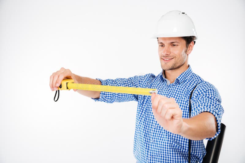 Man Building Engineer in Helmet Using Measuring Tape Stock Image ...