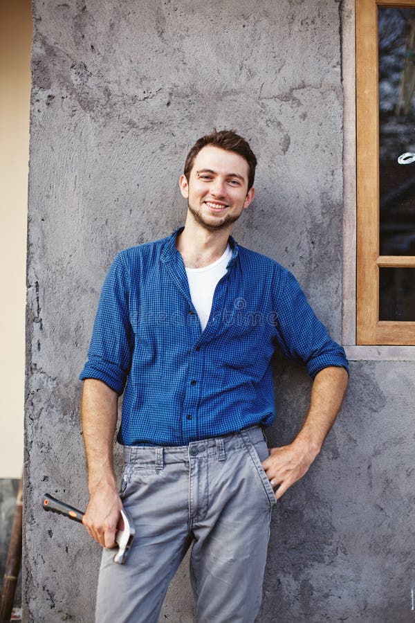 Man building his house stock image. Image of industry - 61747441