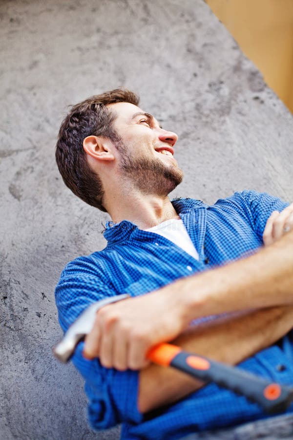 Man building his house stock photo. Image of contractor - 61747446