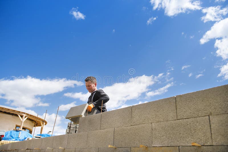Man building a house stock photo. Image of layer, carry - 53711414
