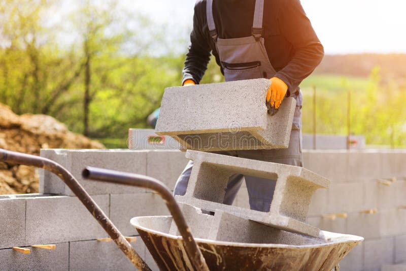 Man building a house stock photo. Image of concrete, manual - 53957694