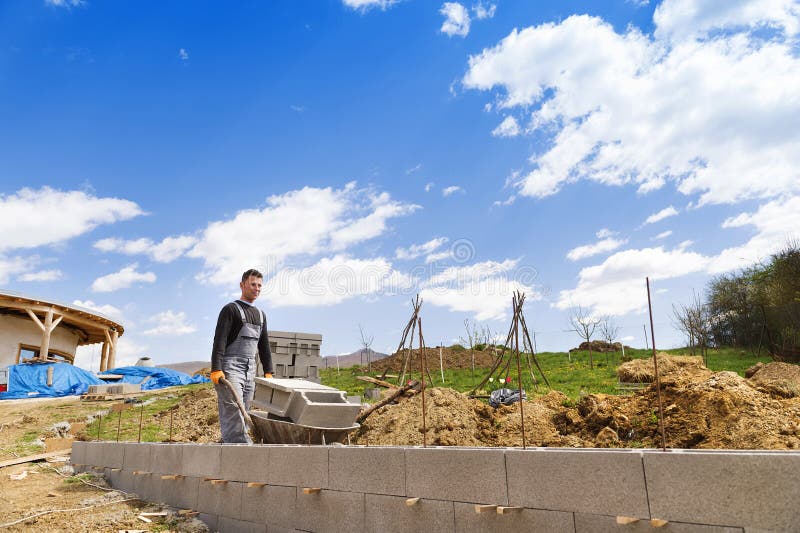 Man building a house stock photo. Image of hands, bricklayer - 53958438